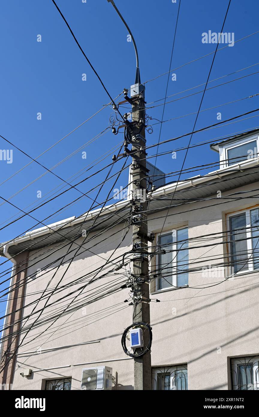 cables and wires on an electric pole. vertical Stock Photo - Alamy