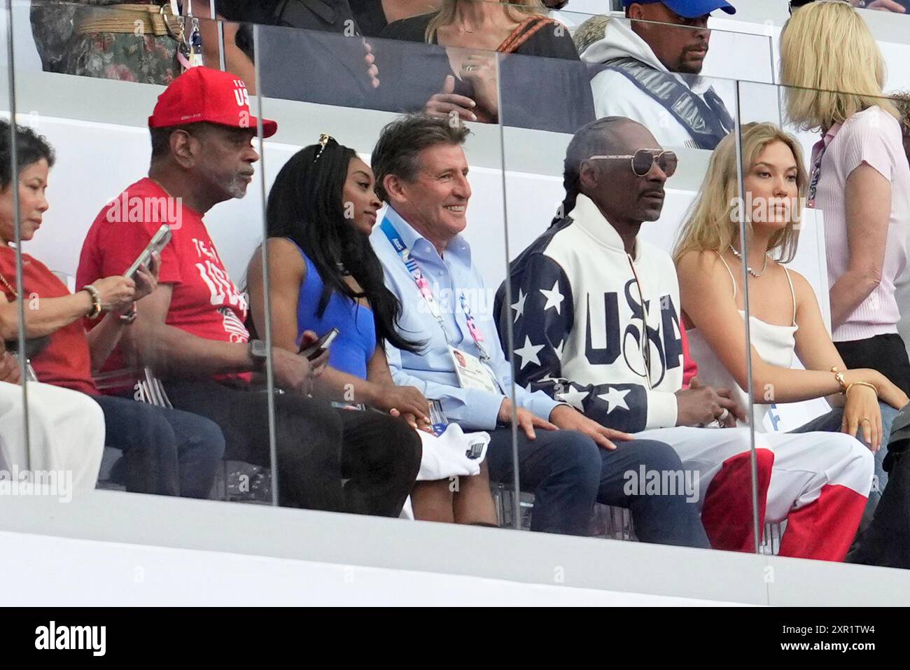 Gymnast Simone Biles, 3rd left, with her parents, sits next to IAAF ...