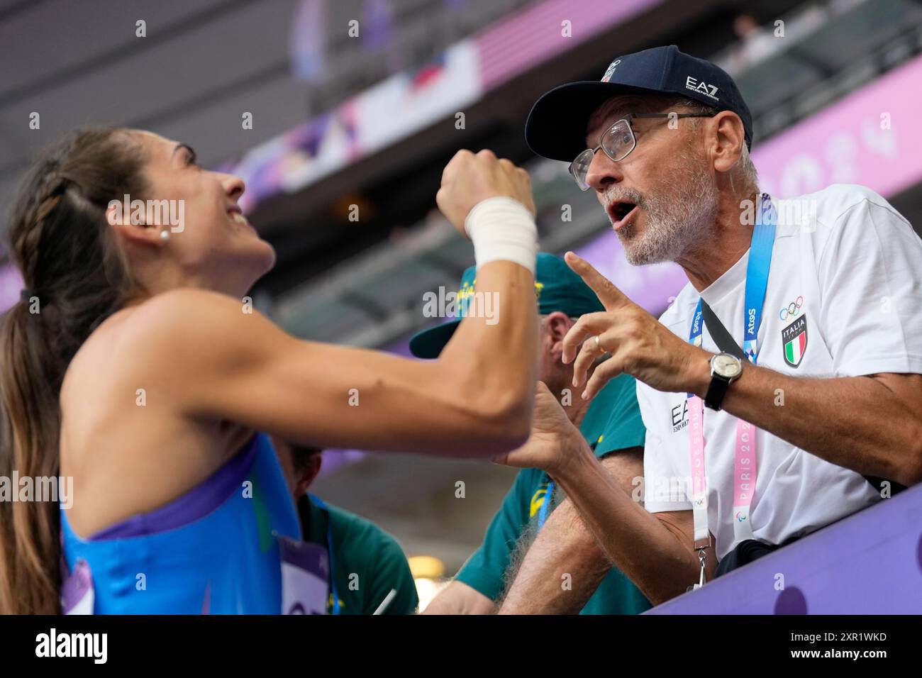 Sveva Gerevini, of Italy, celebrates in front of her coach while ...