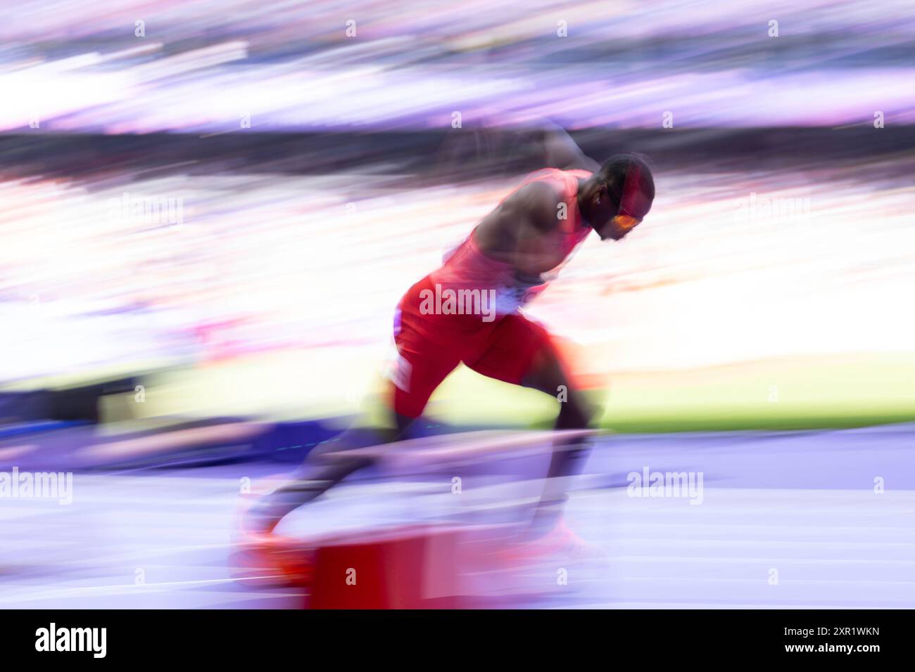 Aaron Brown of Canada competes during Men's 4 x 100m Relay Round 1 of ...