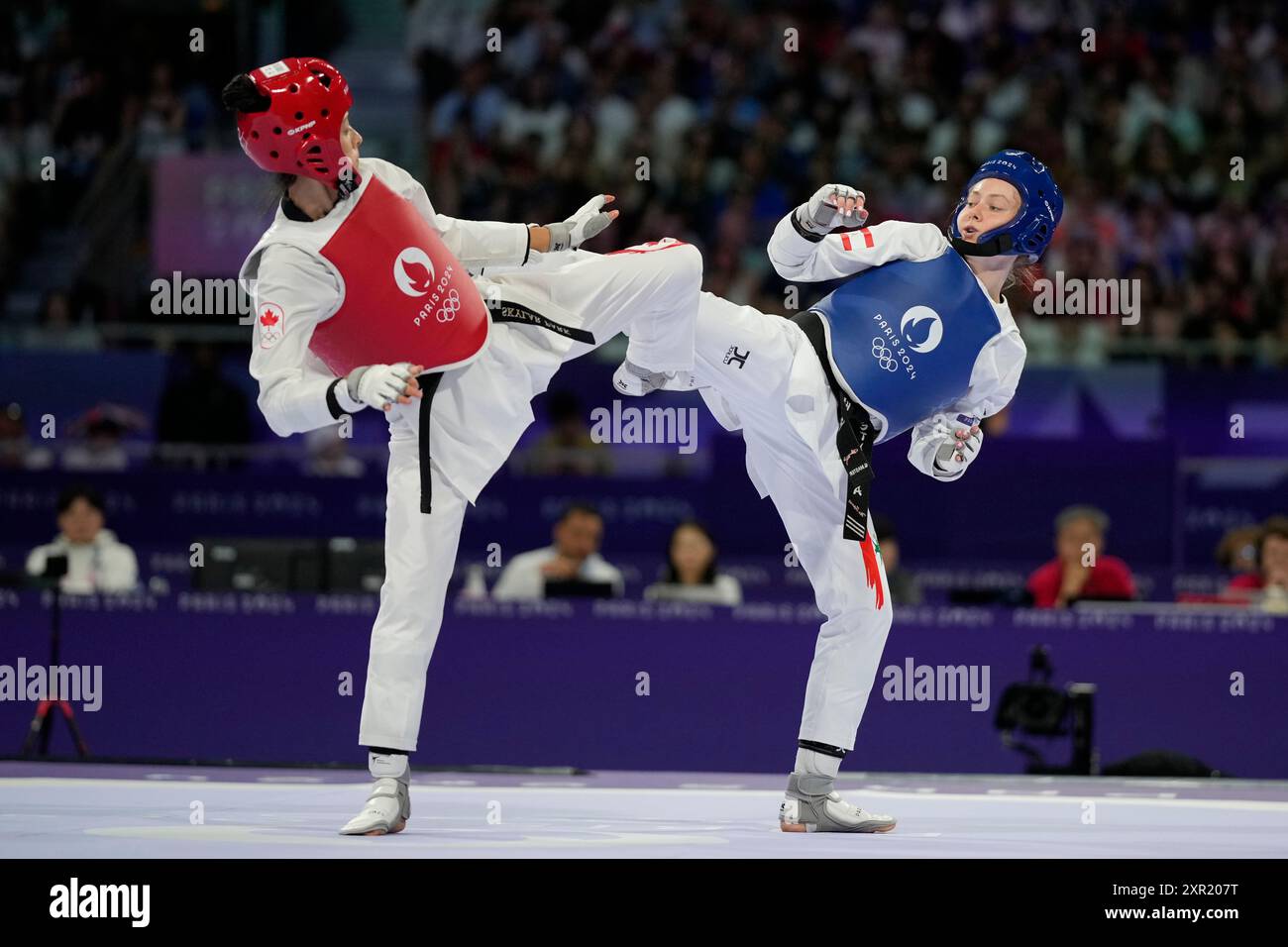 Canada's Skylar Park competes with Lebanon's Laetitia Aoun in a women's ...