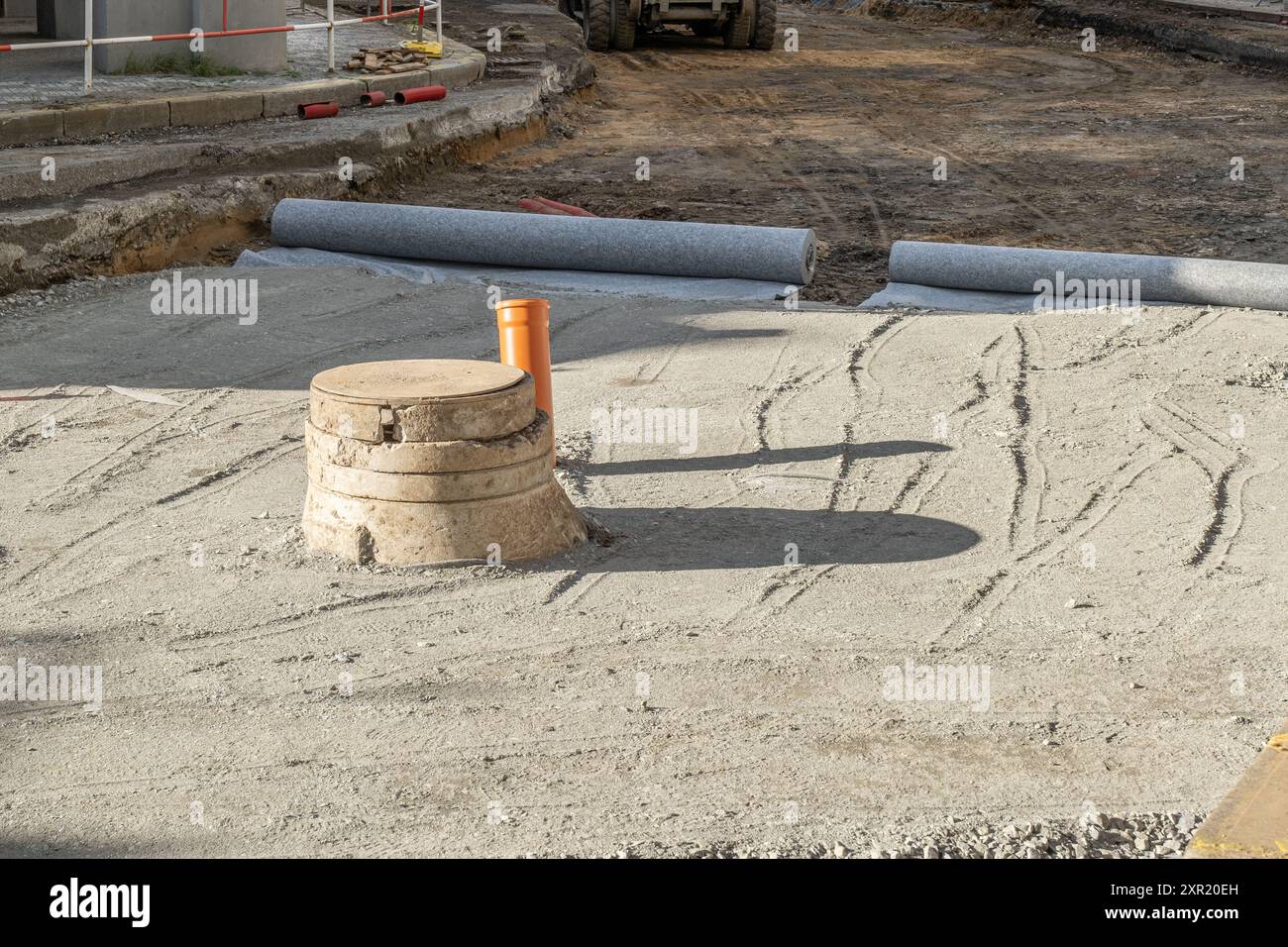 A roll of geotextile is laid on road construction. layer of Modern road ...