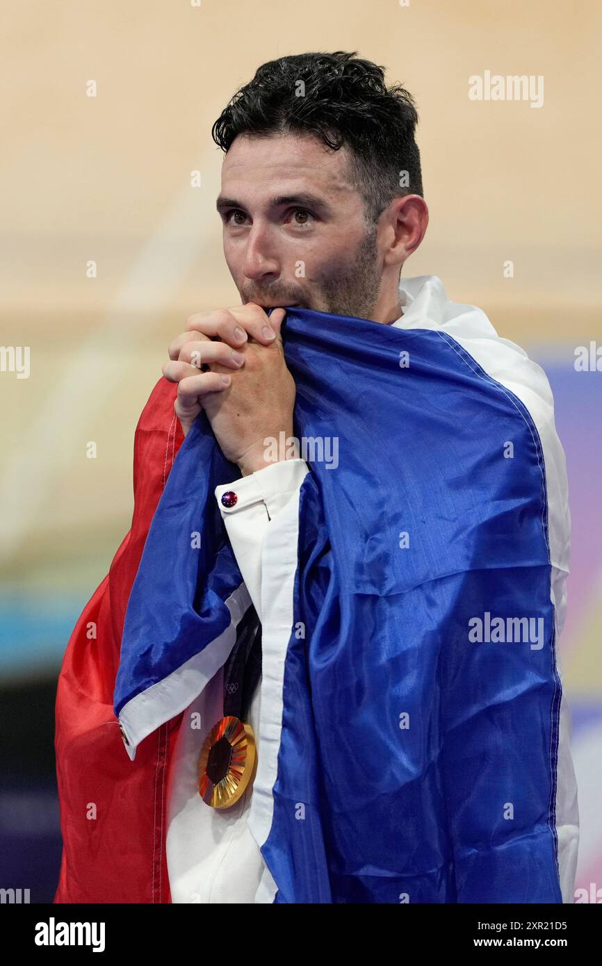 Benjamin Thomas of France poses wrapped in the French flag after ...