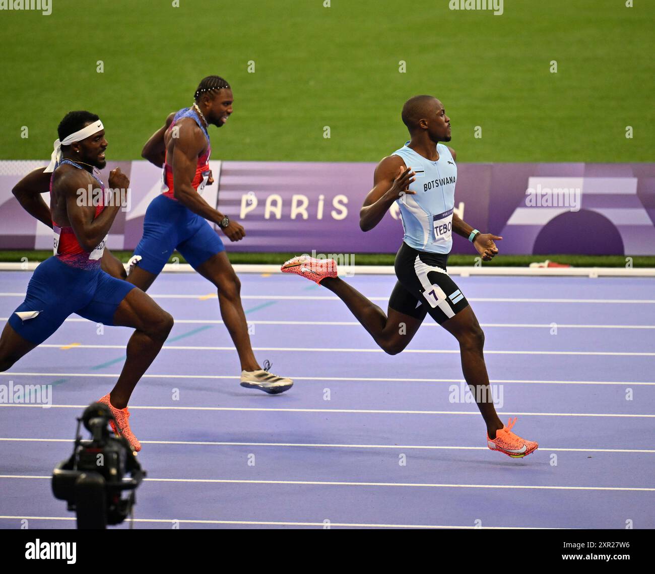 TEBOGO Letsile of Botswana (R) competes during the men's athletics 200m ...