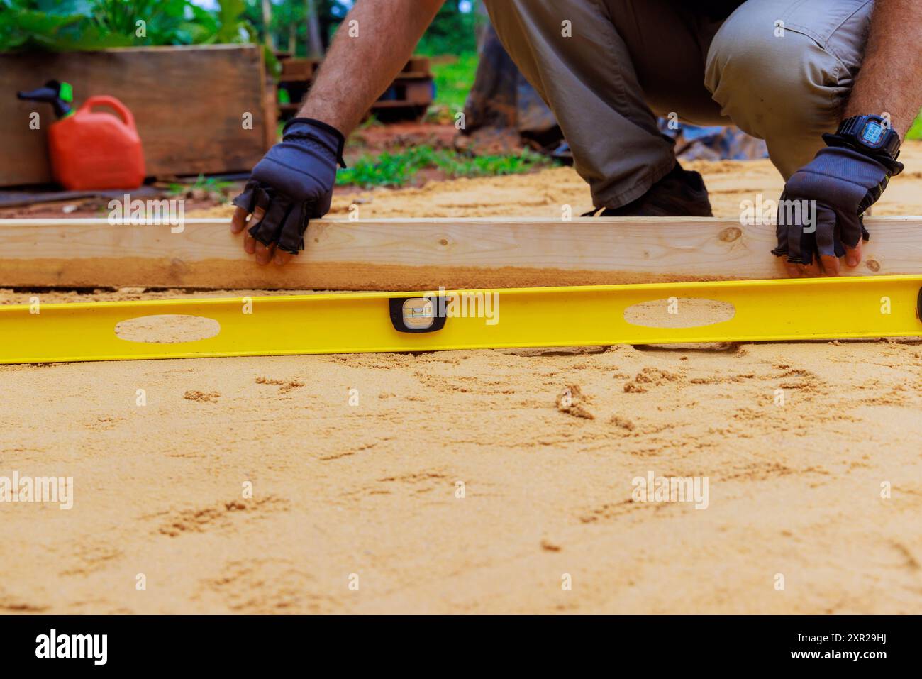 Sand leveling before installation of new swimming pool in backyard ...
