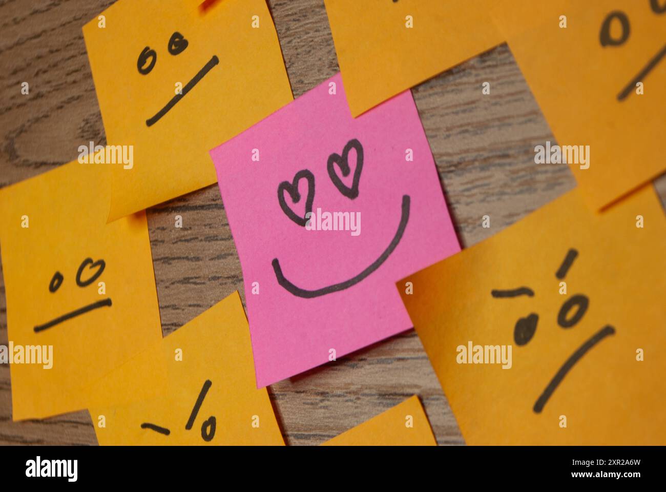 concept of falling in love with small office notes with multiple faces ...