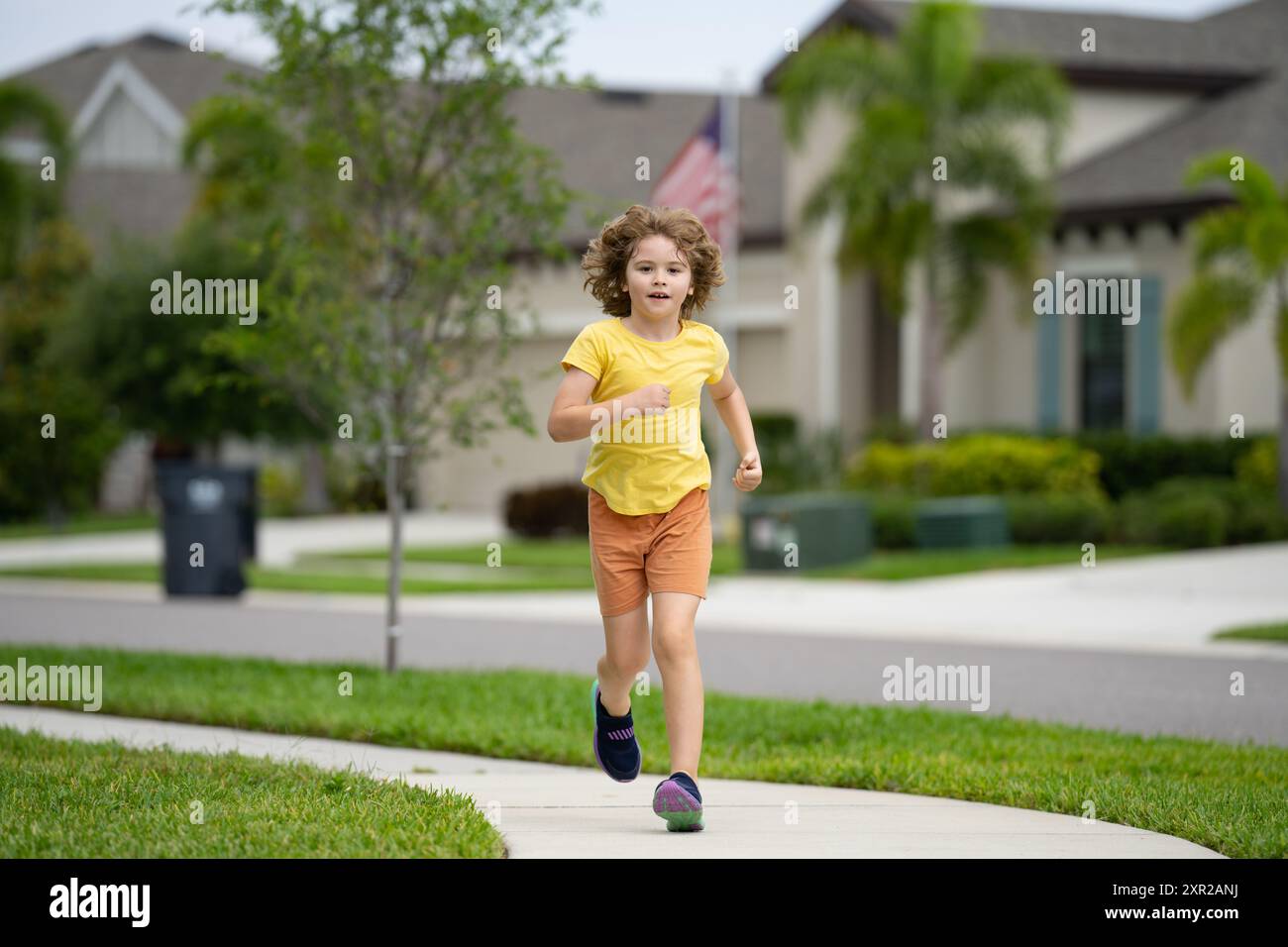 Excited Kid running in street. Amazed child enjoy run. Happy little boy ...
