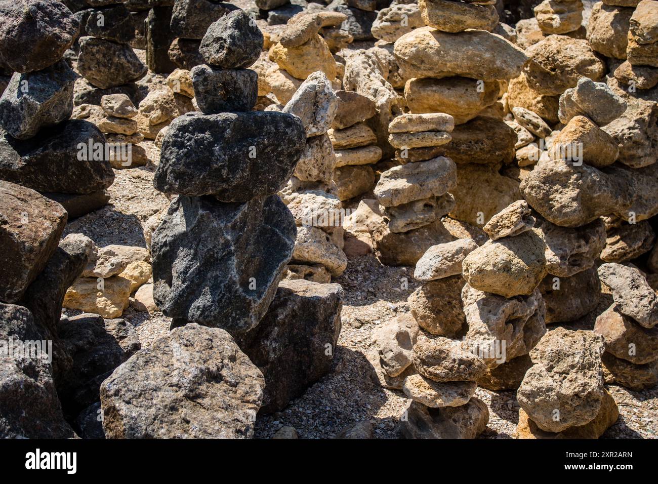 Odesa, Ukraine, August 08, 2024 Pile of stones built on Odesa beach ...