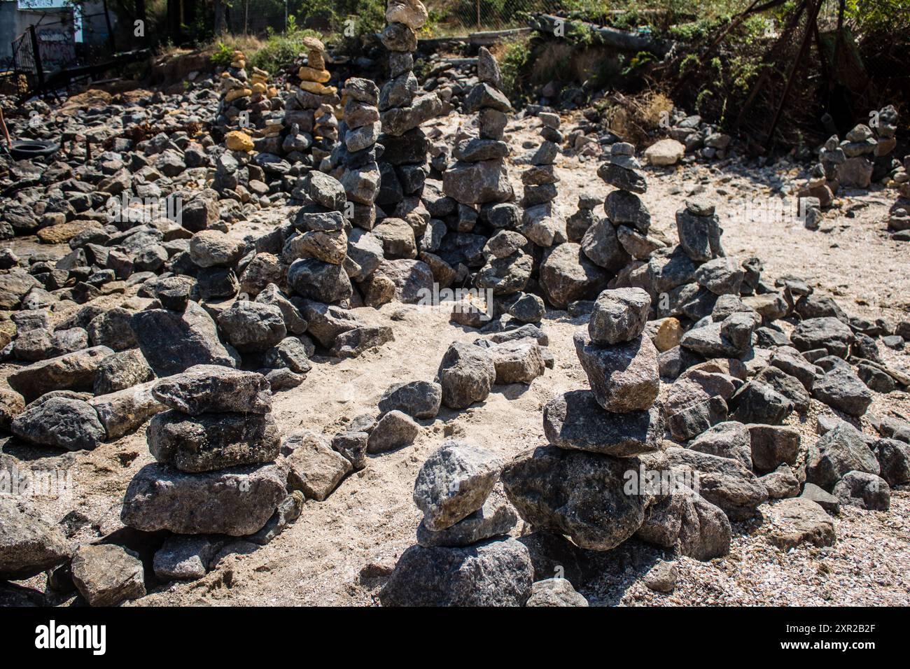 Odesa, Ukraine, August 08, 2024 Pile of stones built on Odesa beach ...