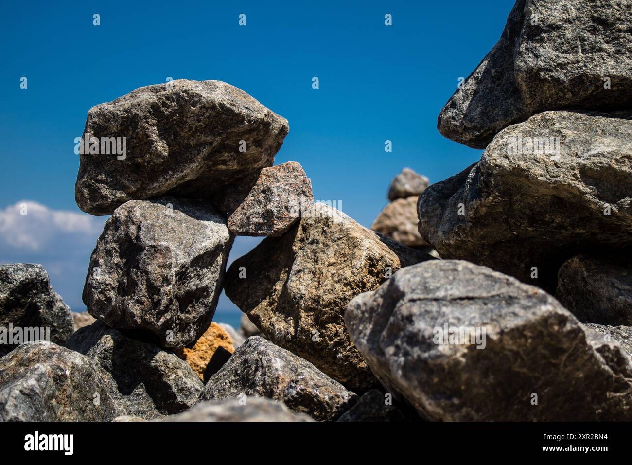 Odesa, Ukraine, August 08, 2024 Pile of stones built on Odesa beach ...