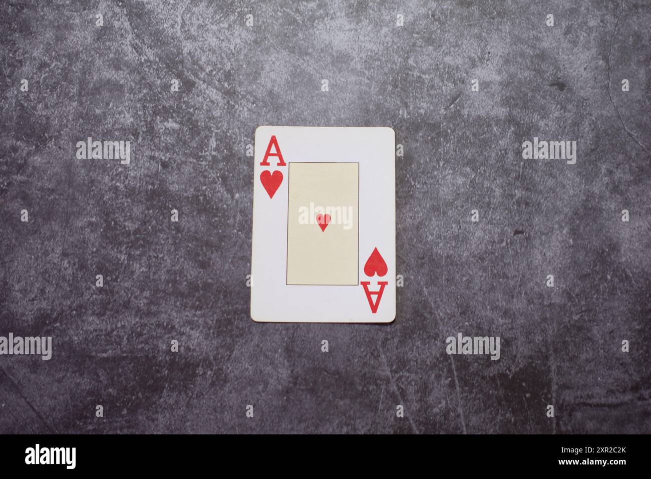 French deck card with ace of hearts on a textured table Stock Photo - Alamy