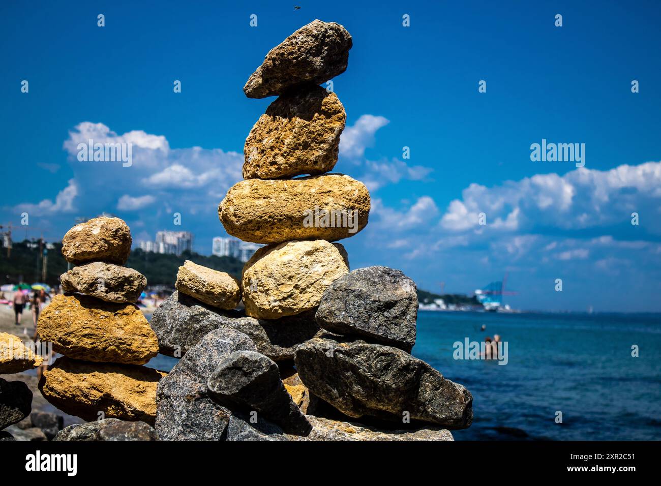 Odesa, Ukraine, August 08, 2024 Pile of stones built on Odesa beach ...
