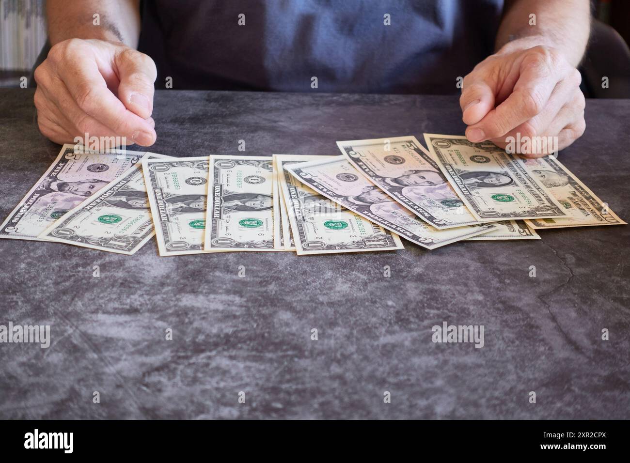 Mans hands counting dollar banknotes hi-res stock photography and ...