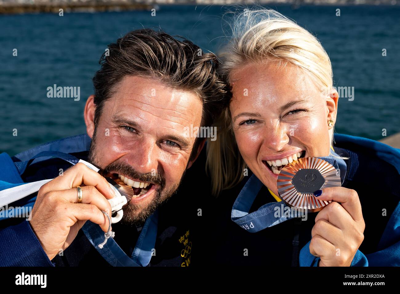Anton Dahlberg and Lovisa Karlsson of, Sweden. , . pose with their bronze medals after the medal ...