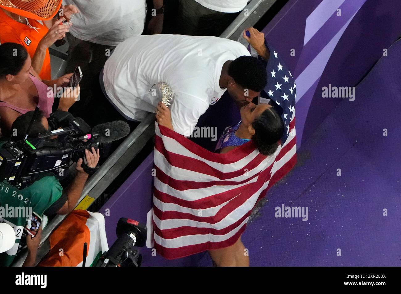 Sydney McLaughlin-Levrone gets a kiss from her husband, Andre Levrone ...