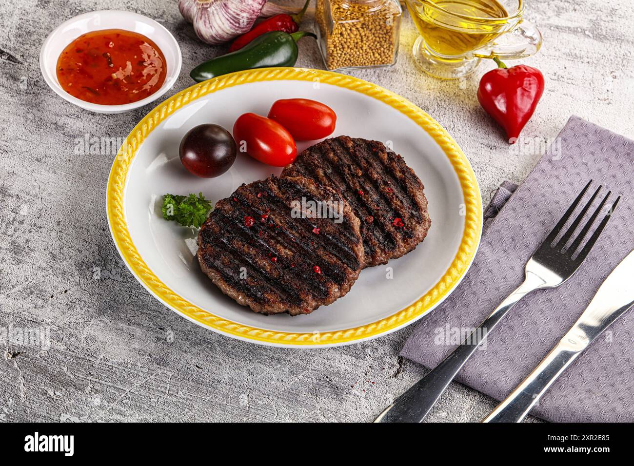 Grilled beef burger cutlet with sauce Stock Photo - Alamy