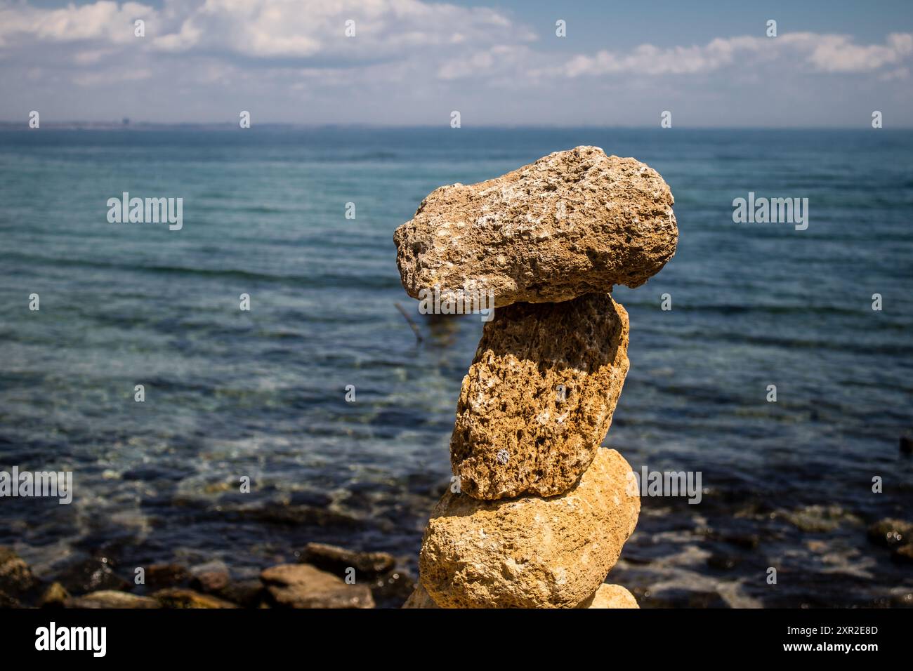 Odesa, Ukraine, August 08, 2024 Pile of stones built on Odesa beach ...