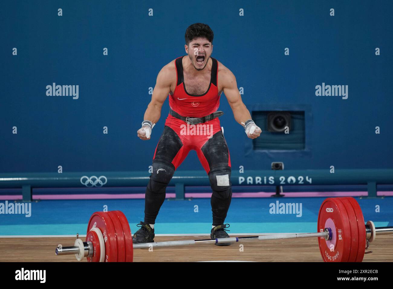 Muhammed Ozbek of Turkey reacts during the men's 73kg weightlifting ...