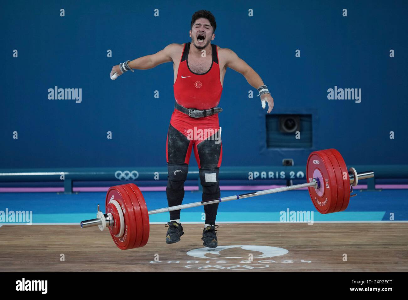 Muhammed Ozbek of Turkey reacts during the men's 73kg weightlifting ...