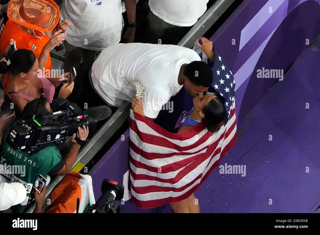 Sydney McLaughlin-Levrone gets a kiss from her husband, Andre Levrone ...