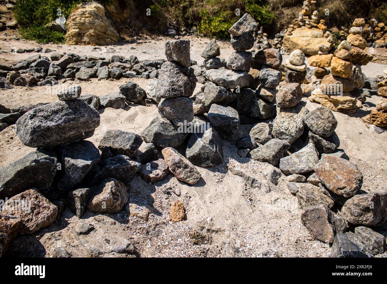 Odesa, Ukraine, August 08, 2024 Pile of stones built on Odesa beach ...