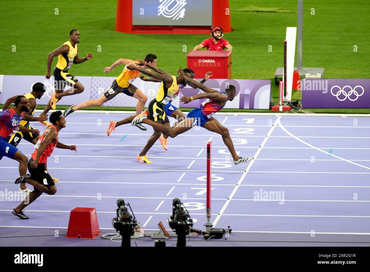Grant Holloway, of the United States, crosses the finish line in the ...