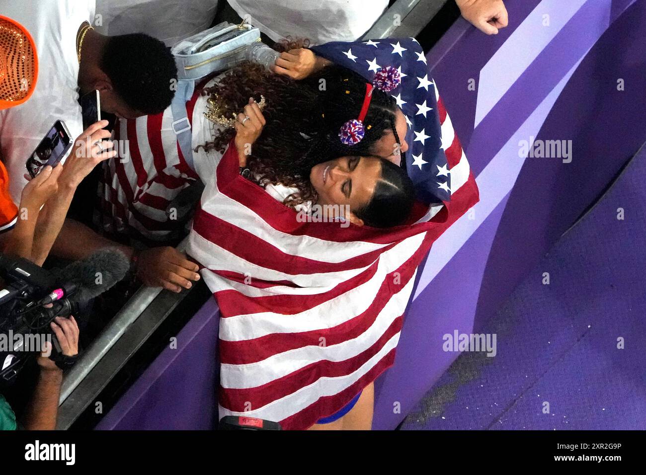 Sydney McLaughlin-Levrone, right, recieves a hug after winning the ...
