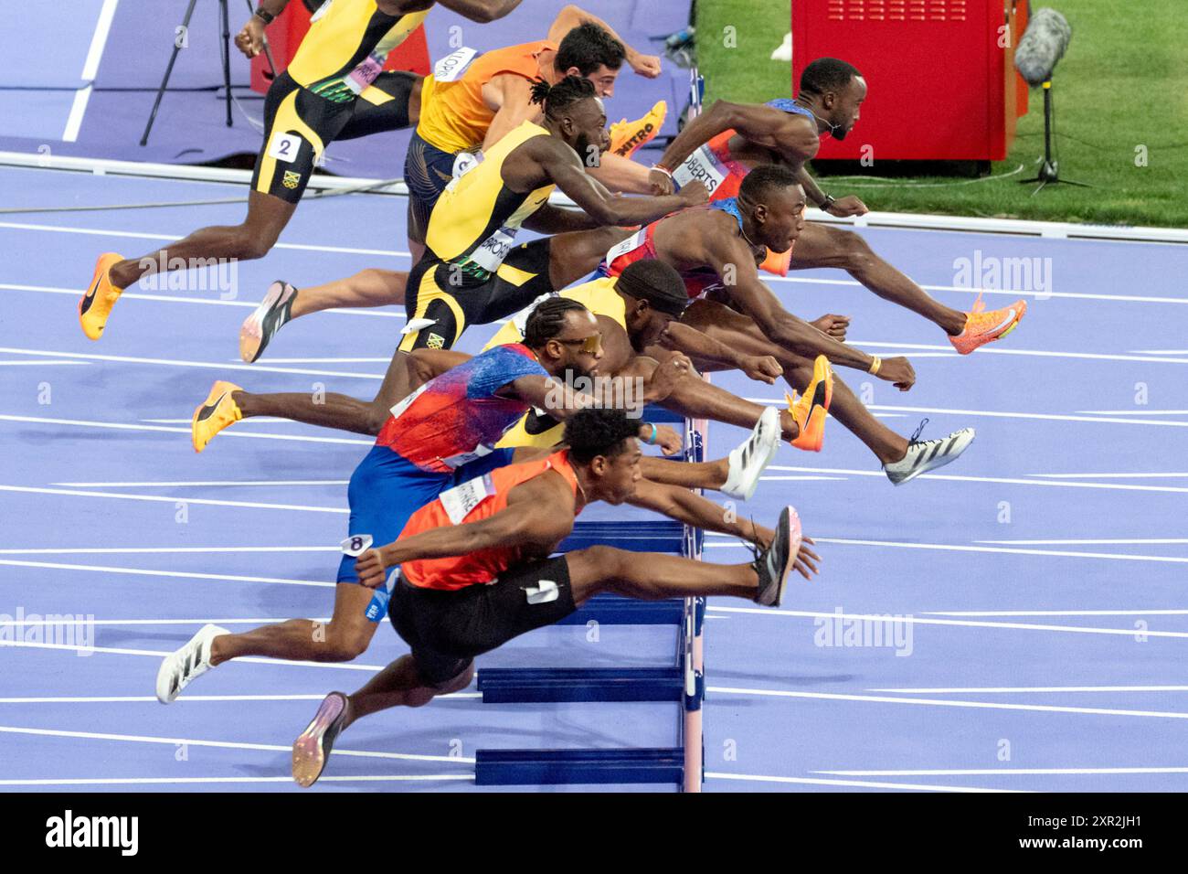 Competitors run in the men's 110-meter hurdles final at the 2024 Summer ...