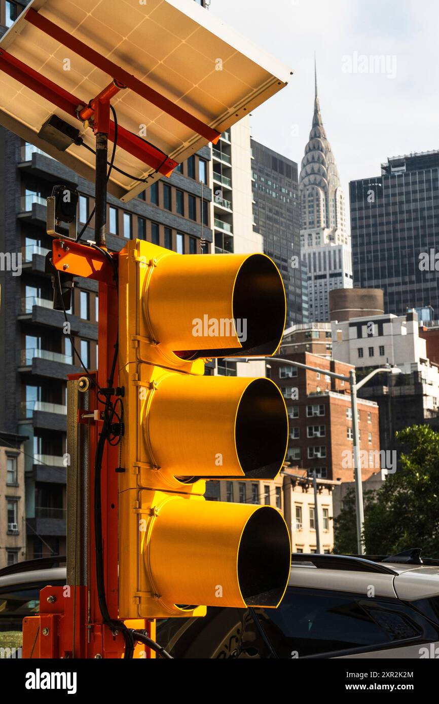 Close-up of a traffic light powered by a small solar panel, 2024, New ...