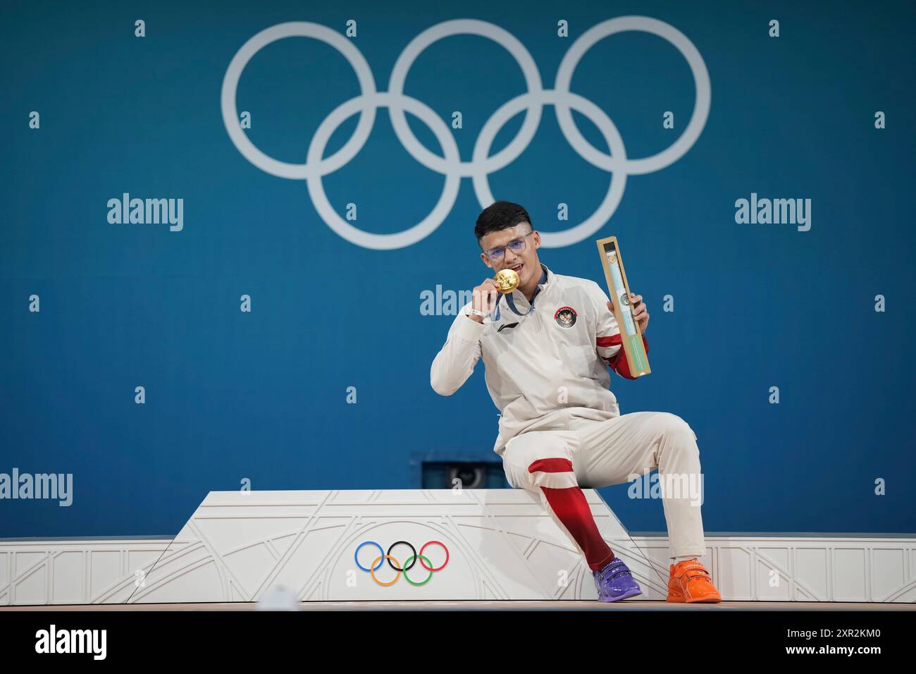 Gold medalist Rizki Juniansyah of Indonesia celebrates on the podium ...