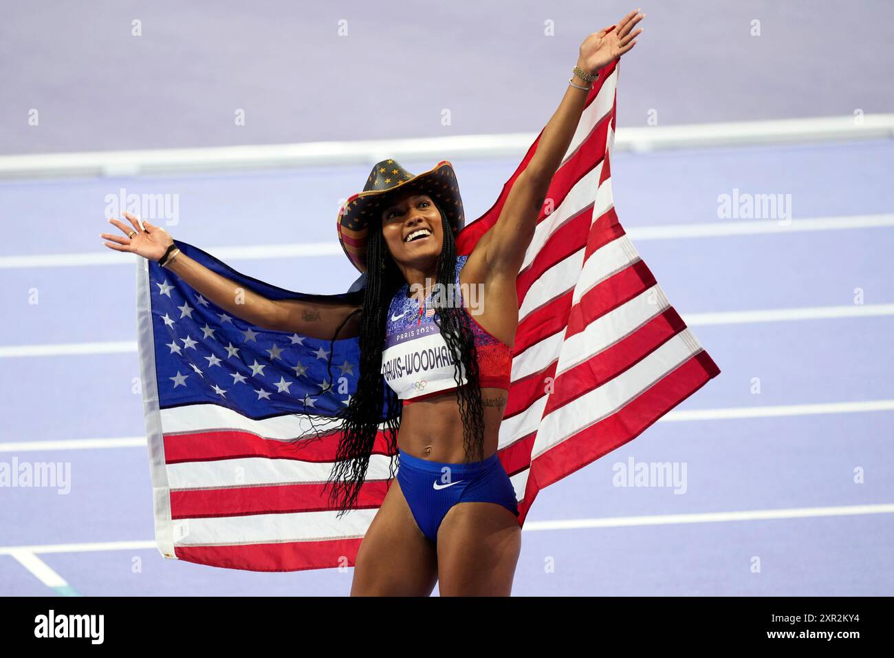 Tara Davis-Woodhall, of the United States, celebrates after winning the ...