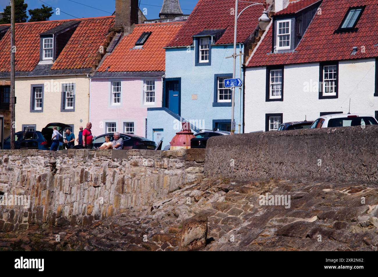 St Monans, harbourside with cottages and day visitors Stock Photo - Alamy