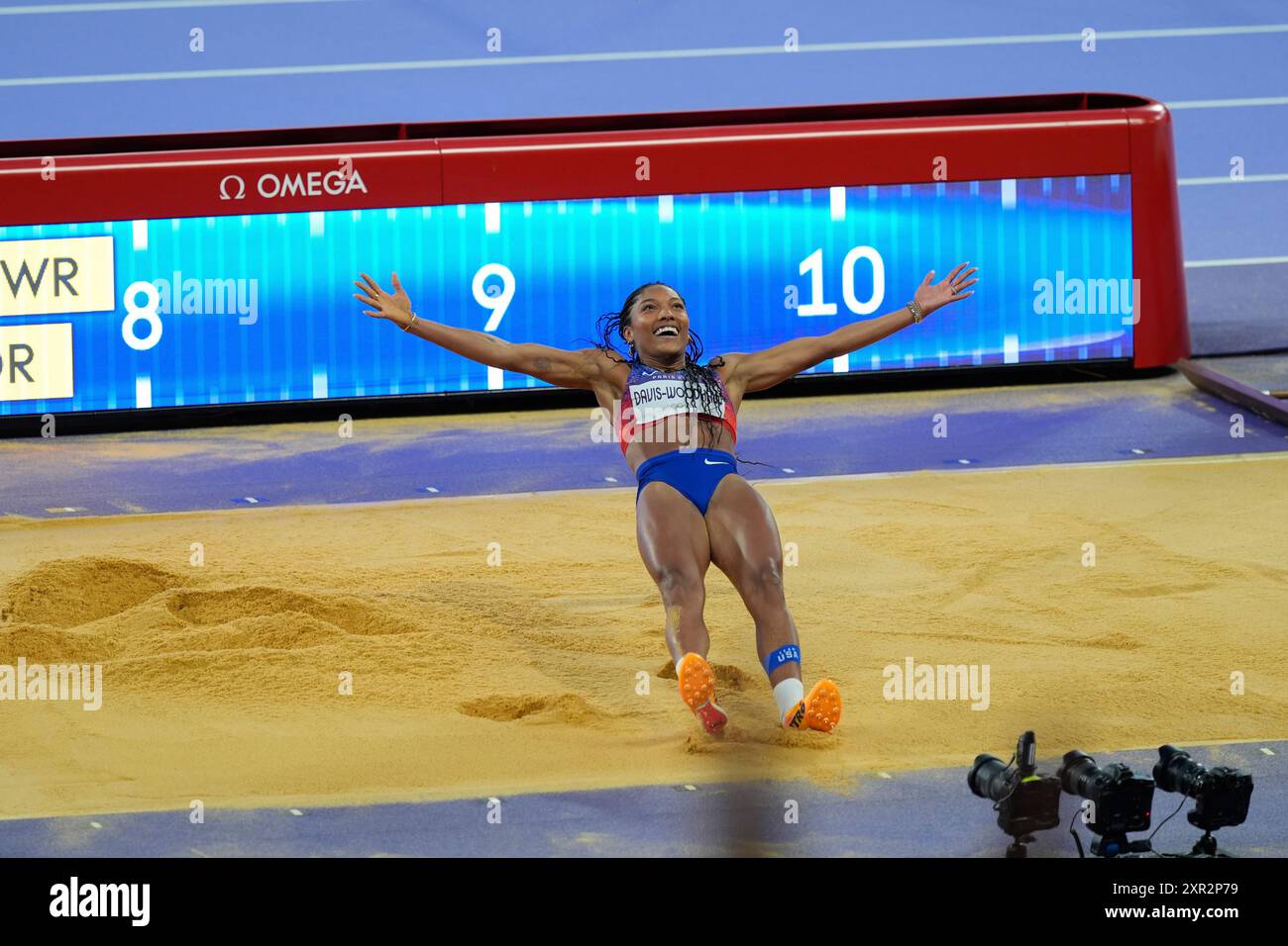 Tara Davis-Woodhall, of the United States, fall back into the pit as ...