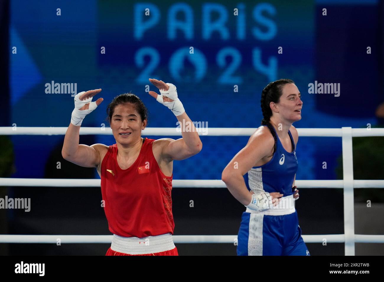 China's Li Qian, left, celebrates after defeating Australia's Caitlin ...