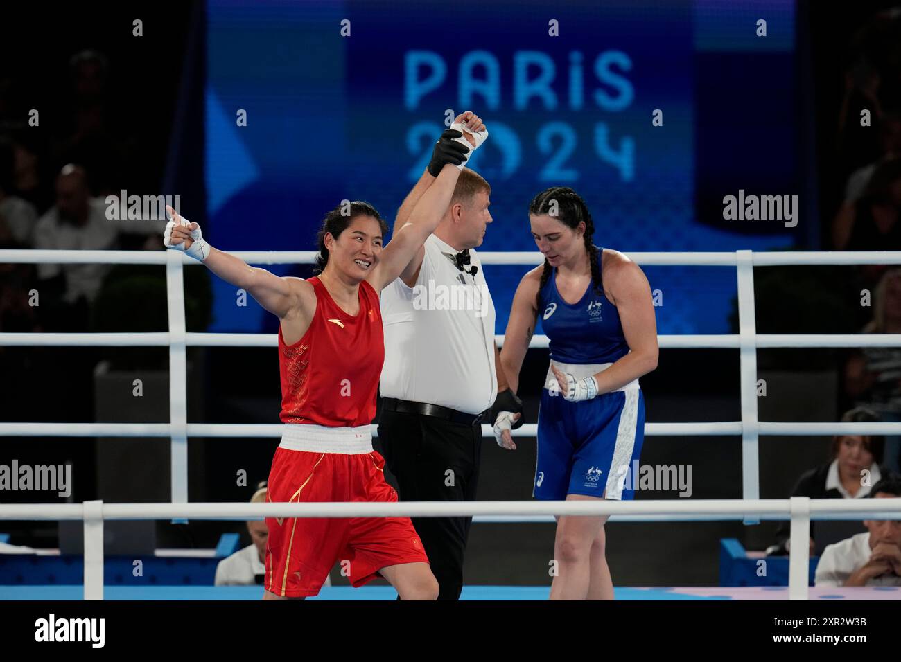 China's Li Qian, left, celebrates after defeating Australia's Caitlin ...