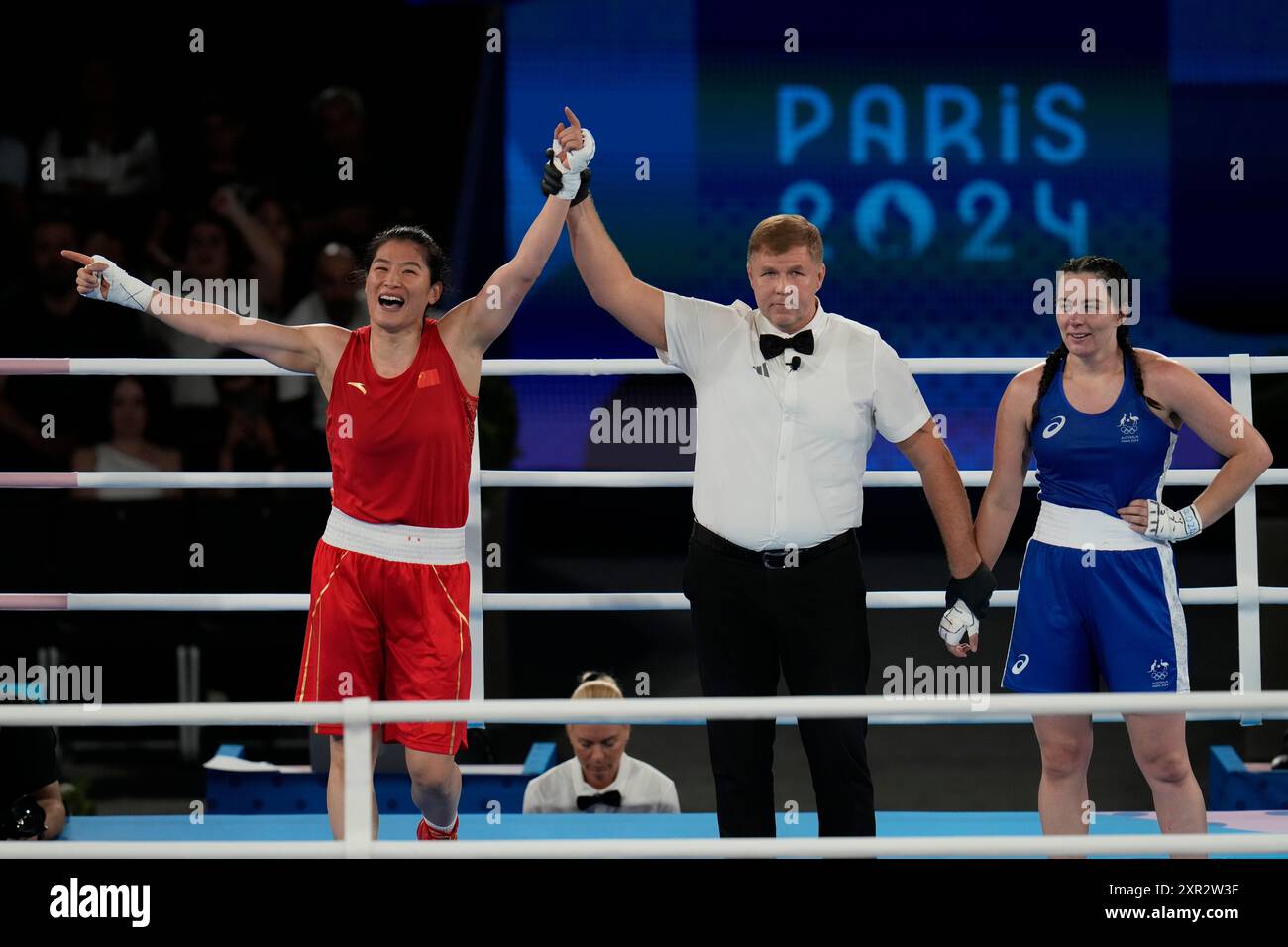 China's Li Qian celebrates after defeating Australia's Caitlin Parker ...
