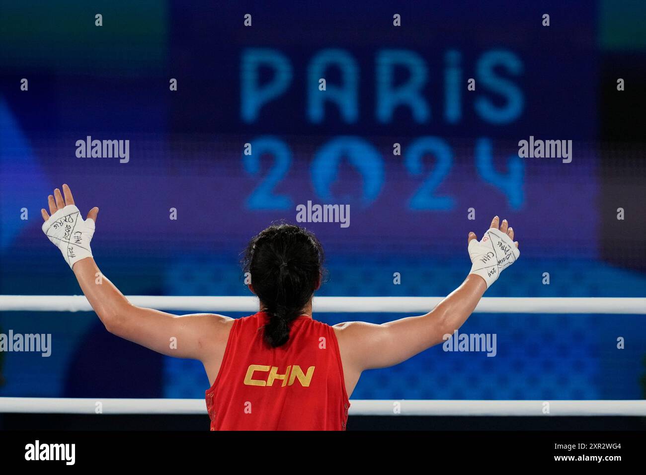 China's Li Qian celebrates after defeating Australia's Caitlin Parker ...
