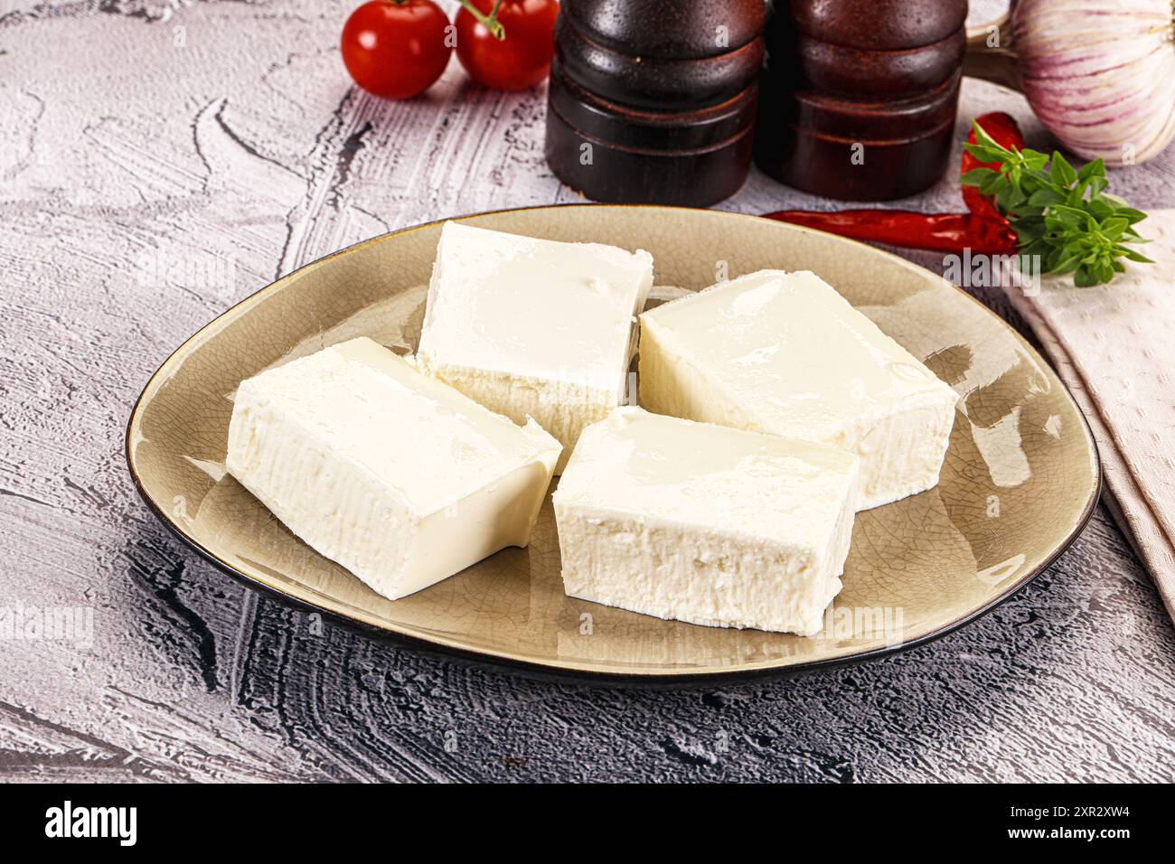 Greek traditional cuisine - Feta cheese bricks Stock Photo - Alamy