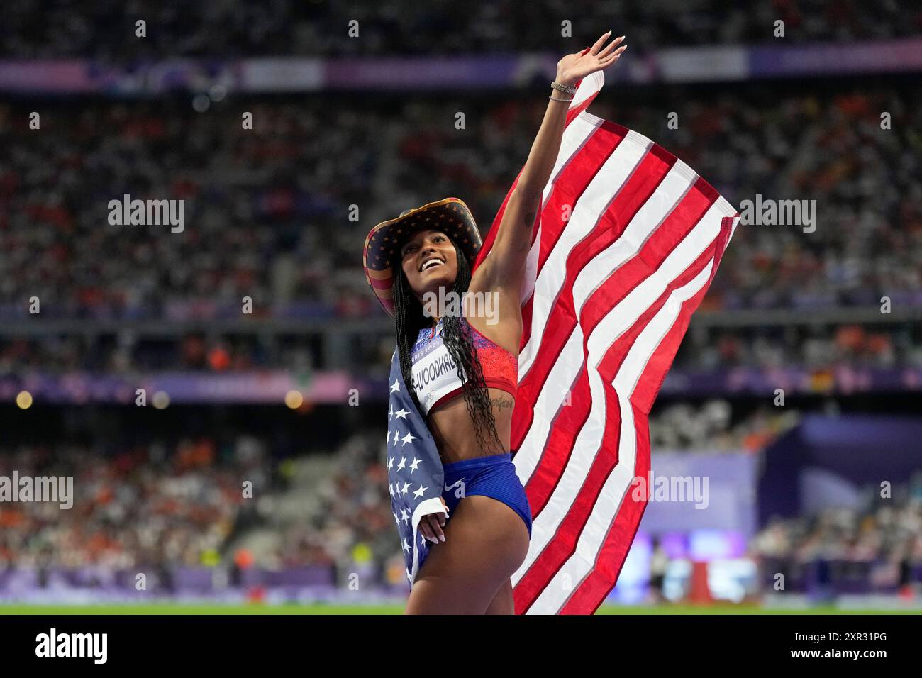 Tara Davis-Woodhall, of the United States, celebrates after winning the ...