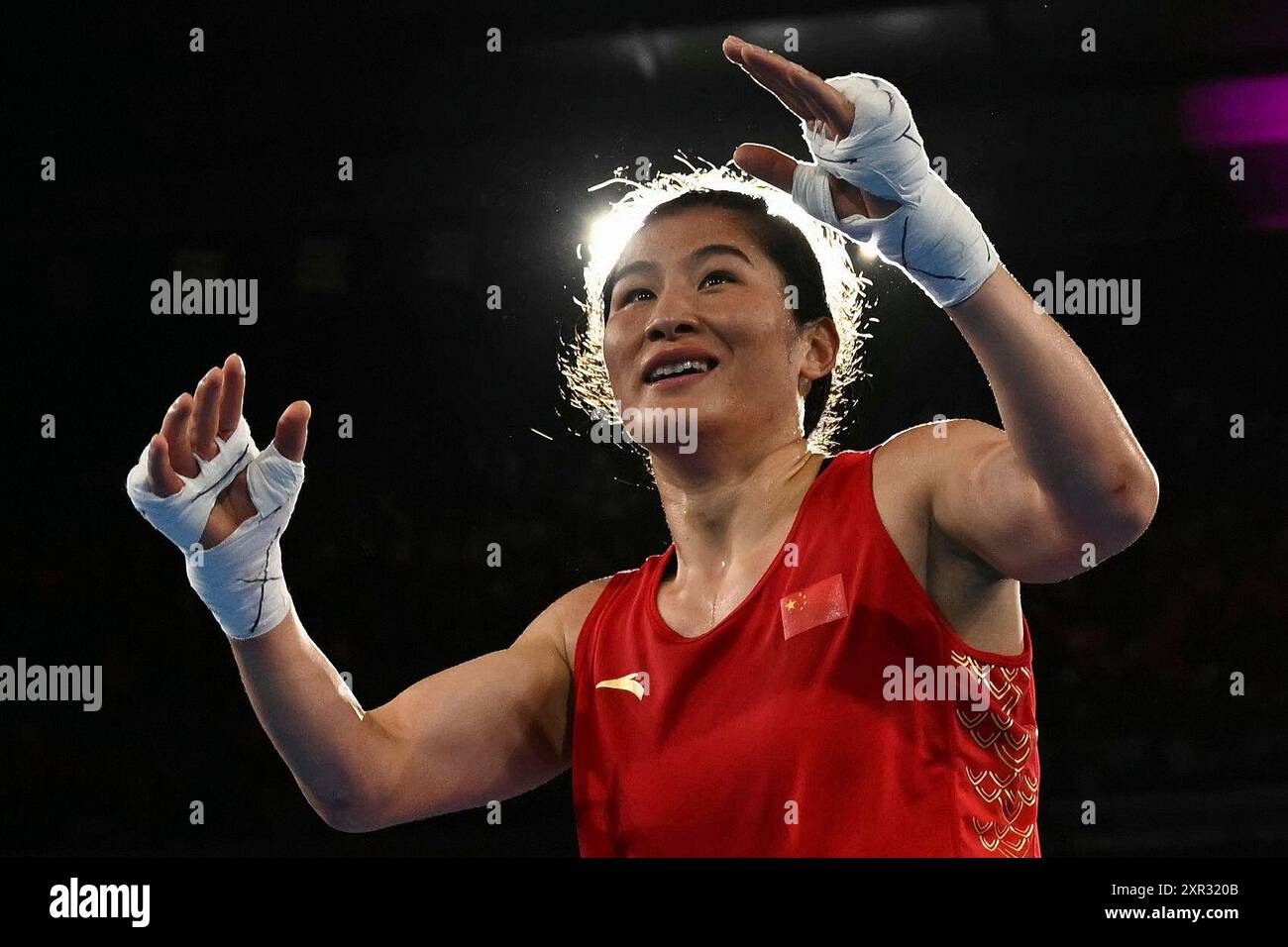 China's Li Qian celebrates after defeating Australia's Caitlin Parker ...
