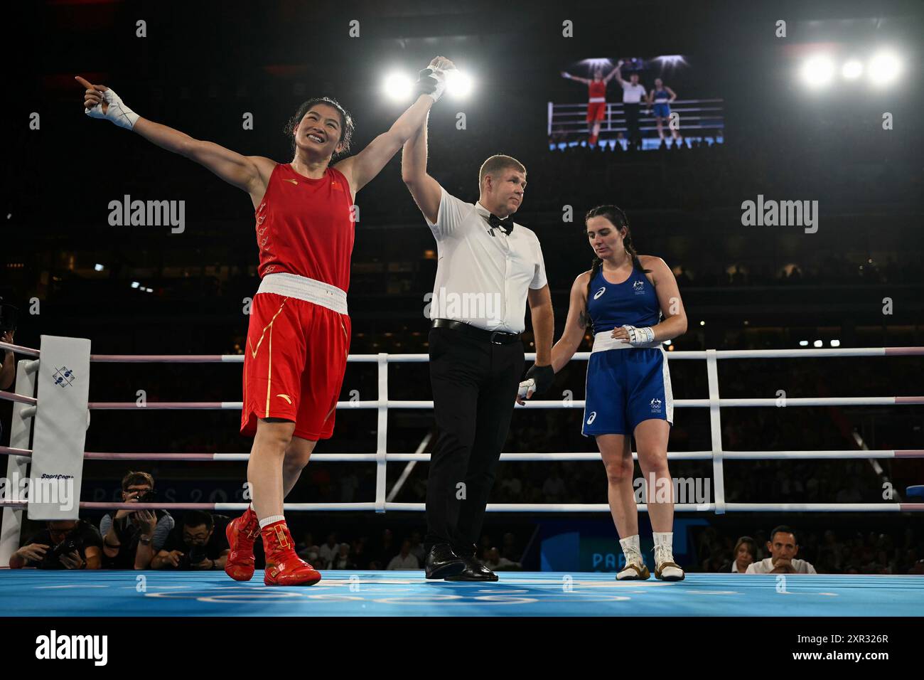 China's Li Qian, left, celebrates after defeating Australia's Caitlin ...