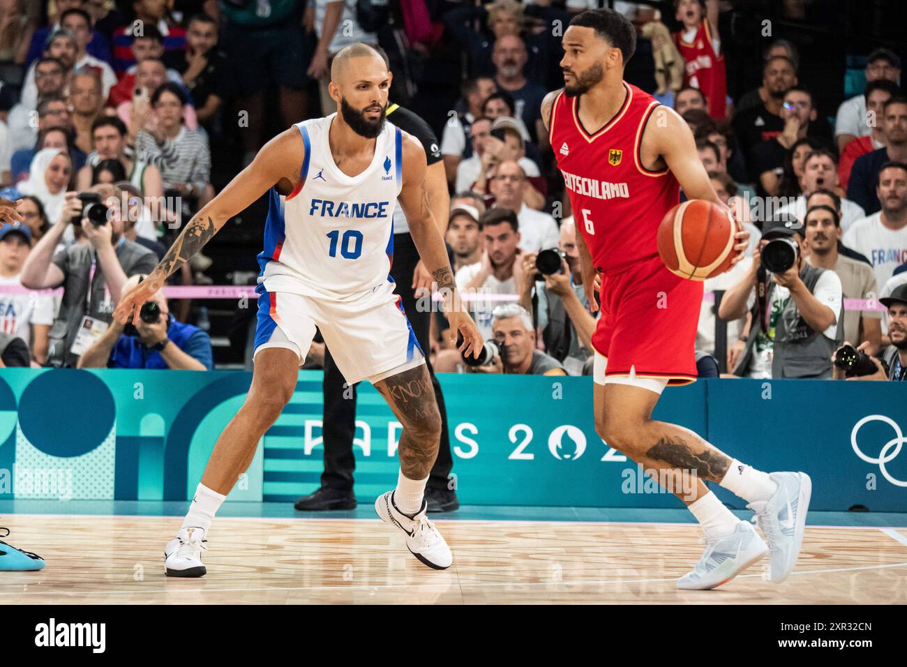 Nick Weiler-Babb ( 6 - Germany) and Evan Fournier ( 10 - France ...