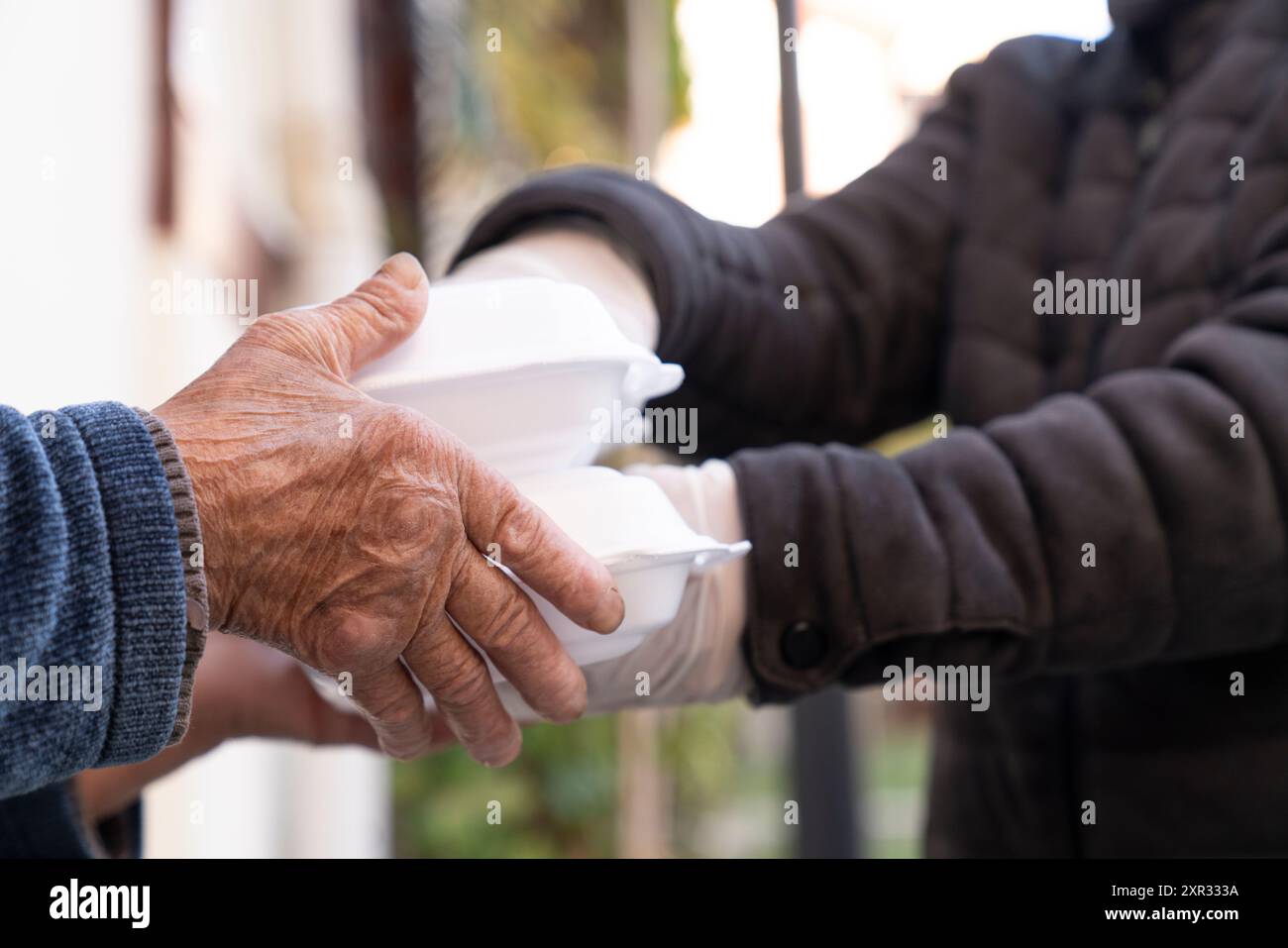 Woman receiving delivery front door hi-res stock photography and images ...
