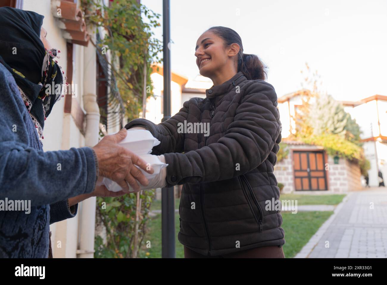 Receiving food delivery at front door hi-res stock photography and ...