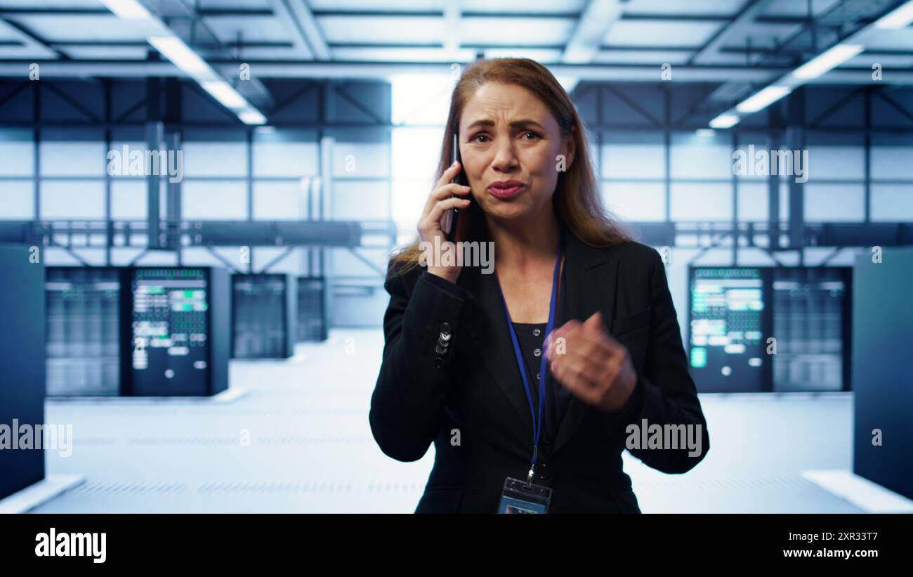 Data center system administrator talking hi-res stock photography and ...