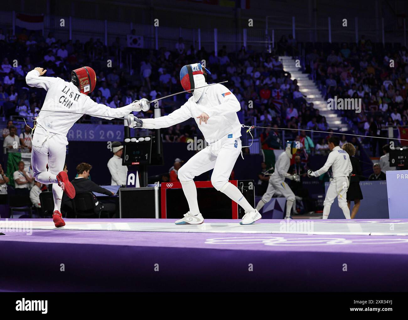Paris, France. 8th Aug, 2024. Li Shuhuan (L) of China competes against ...