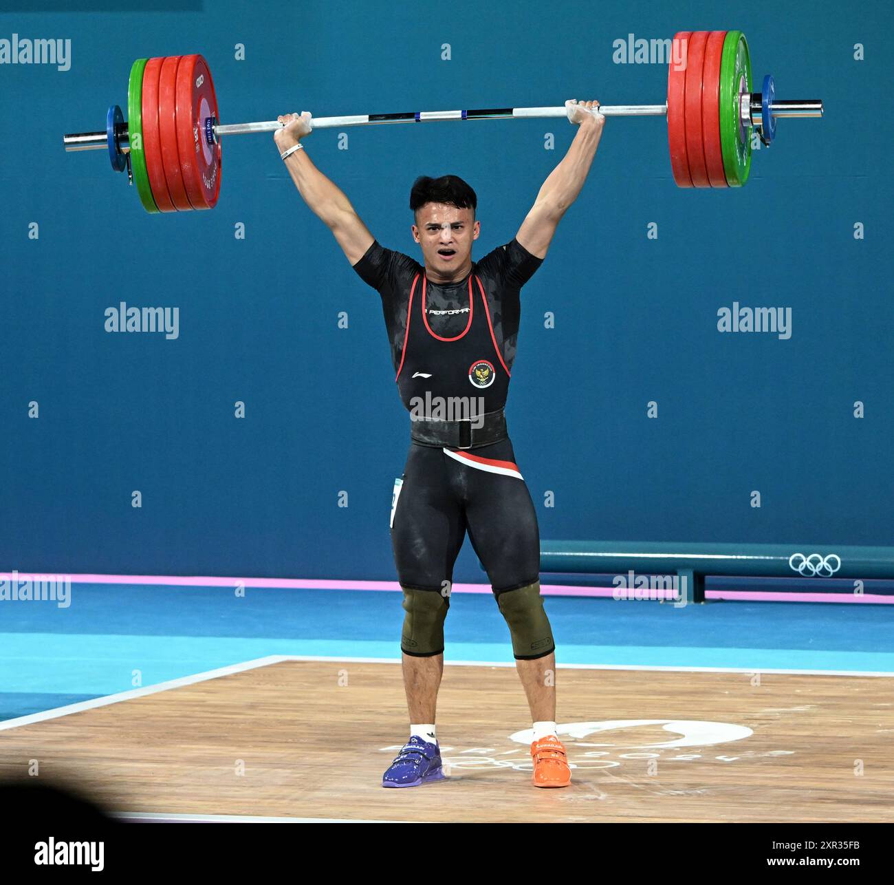 JUNIANSYAH Rizki of Indonesia competes during the men's weightlifting ...