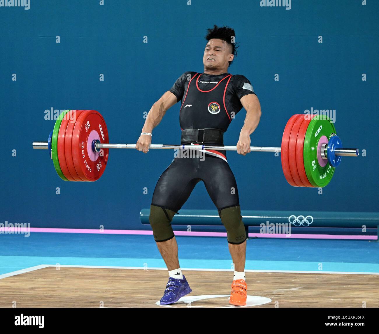 JUNIANSYAH Rizki of Indonesia competes during the men's weightlifting ...
