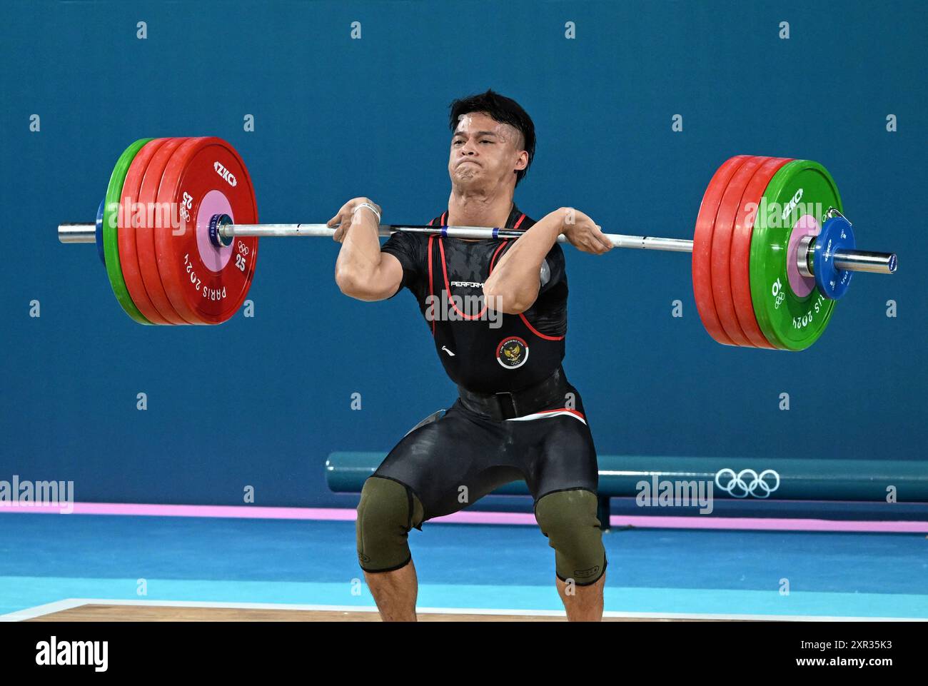 JUNIANSYAH Rizki of Indonesia competes during the men's weightlifting ...