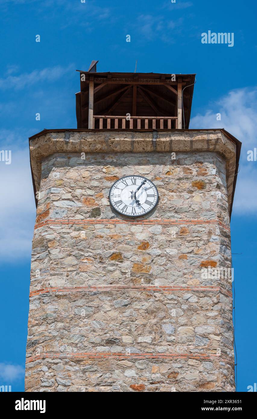 Frozen Time: Old City Clock Tower Showing 5:08 Against a Blue Sky with ...